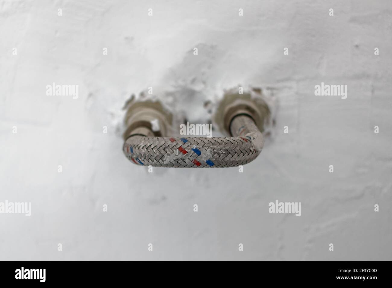 Water supply fittings on the wall Stock Photo - Alamy