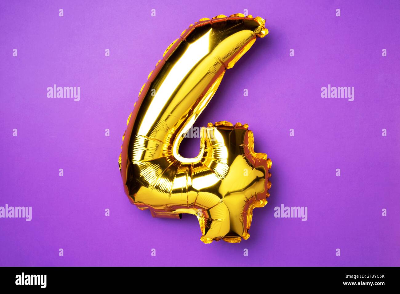 Creative layout. Golden foil balloon number and digit four 4. Birthday ...