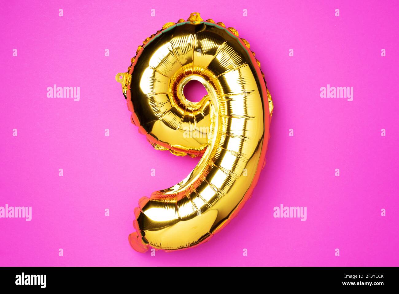 Creative layout. Golden foil balloon number and digit nine 9. Birthday ...