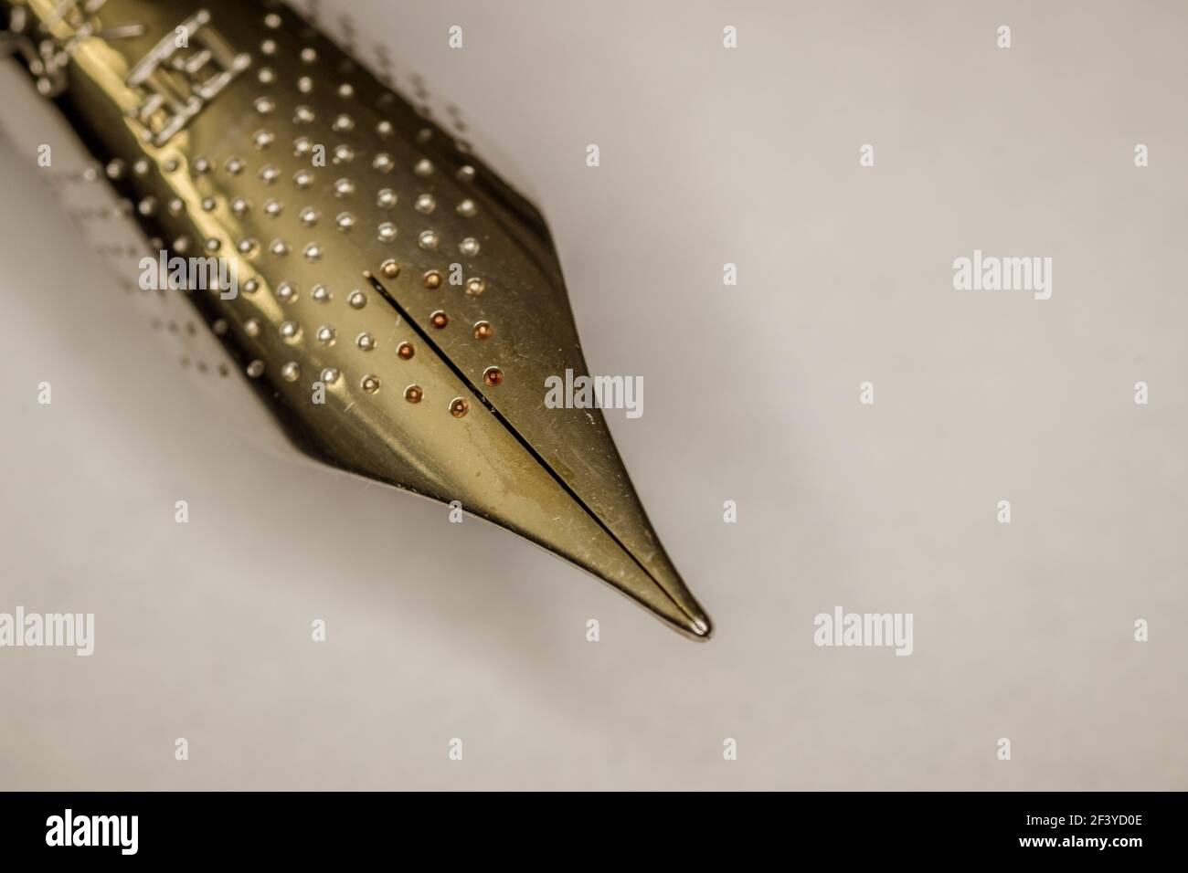 A closeup view of an ornate metal nib of an old fountain pen Stock ...