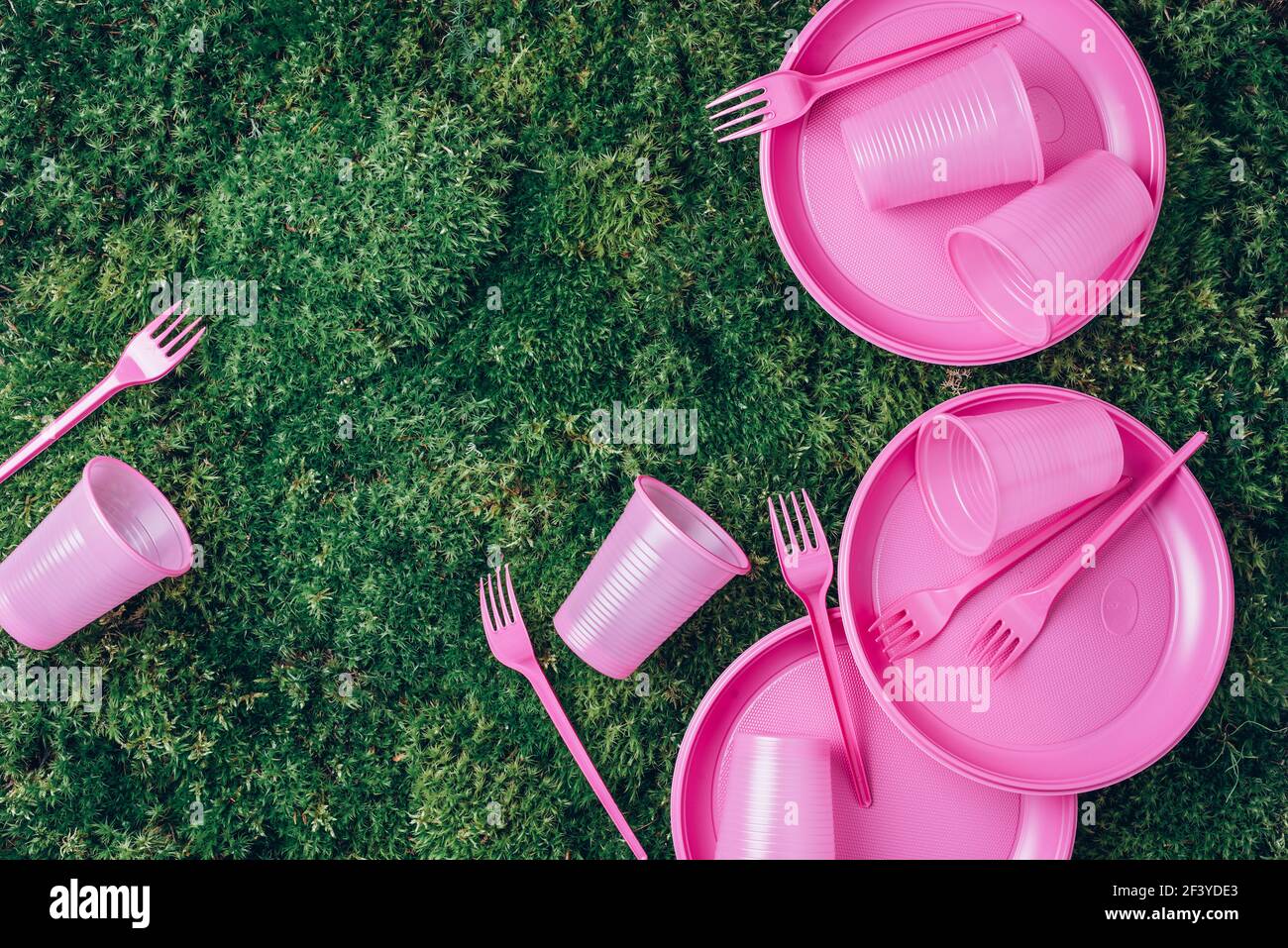 Environmental pollution. Disposable plastic tableware - plastic plates ...