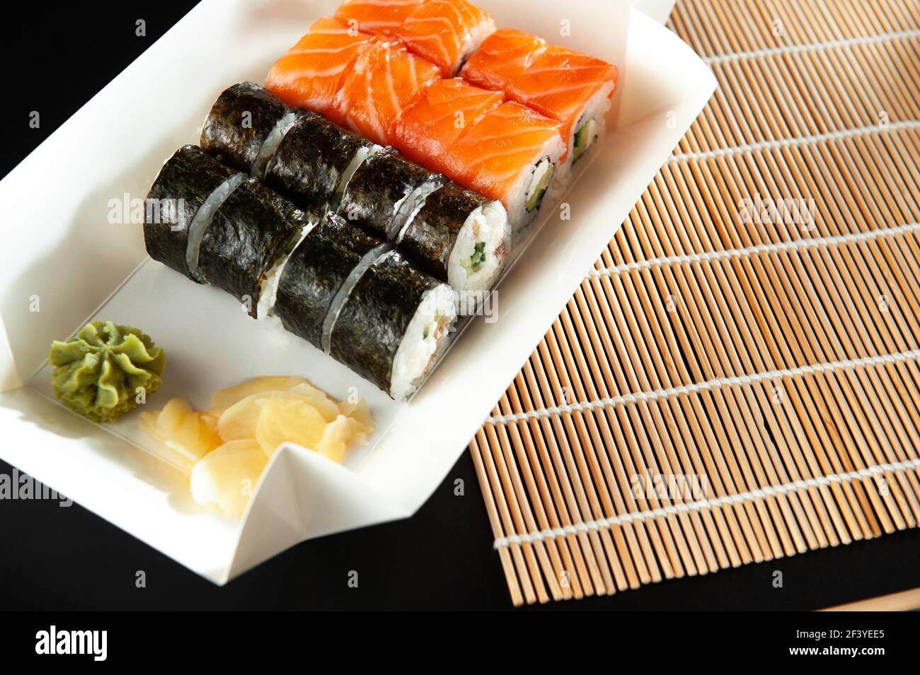 Sushi delivery in a white one-piece container Stock Photo - Alamy