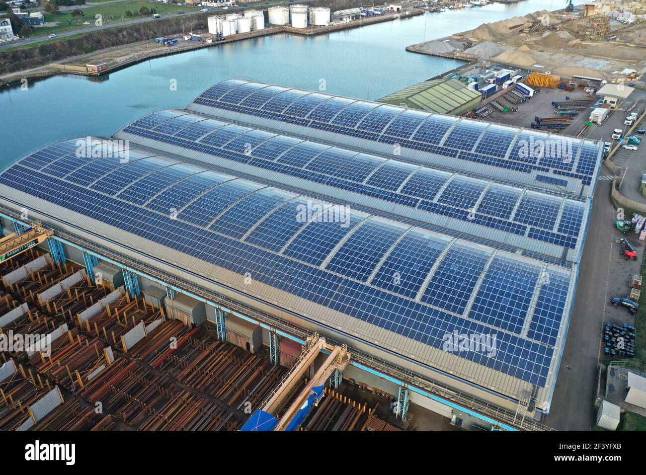 Solar power panels on factory roof Stock Photo - Alamy