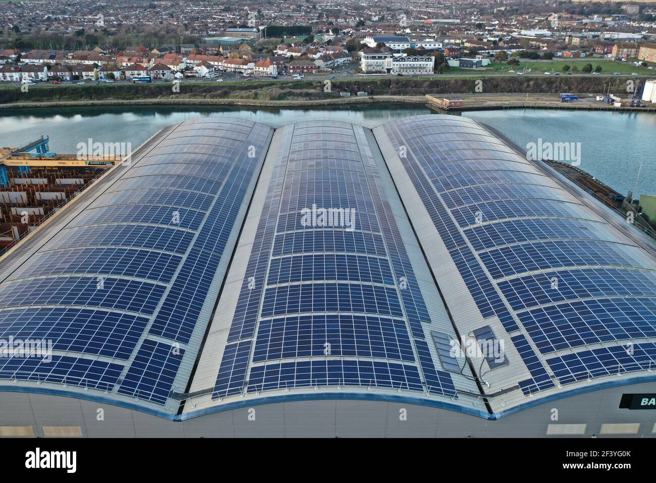 Solar power panels on factory roof Stock Photo - Alamy