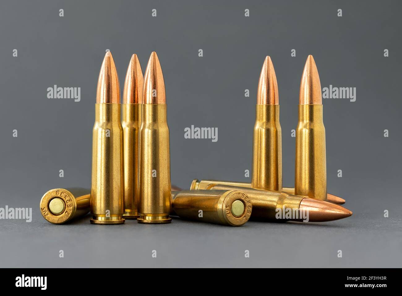 Bullets on gray background. Cartridges 7.62 caliber for Kalashnikov ...