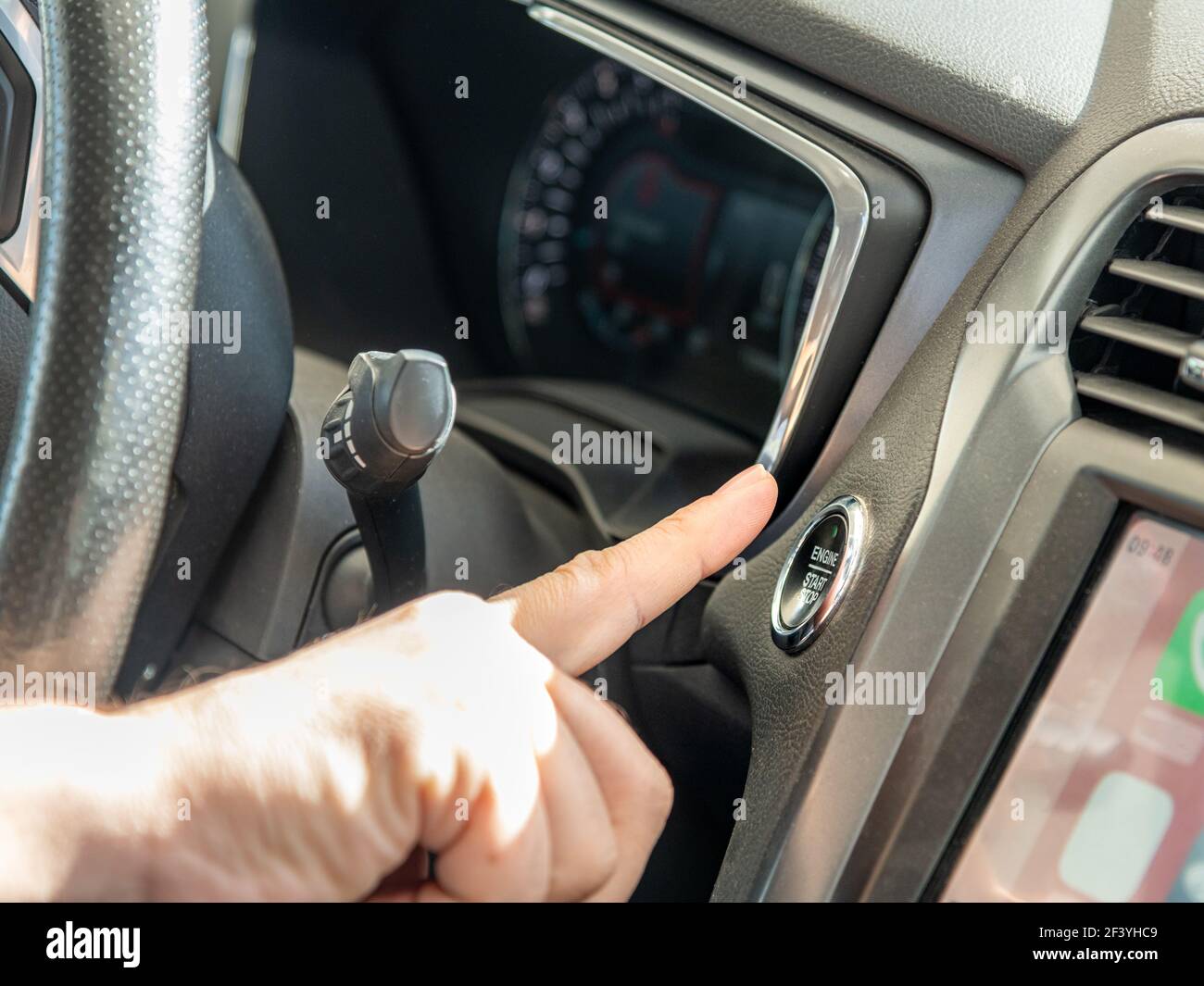 Car start stop system with finger pressing the button Stock Photo - Alamy
