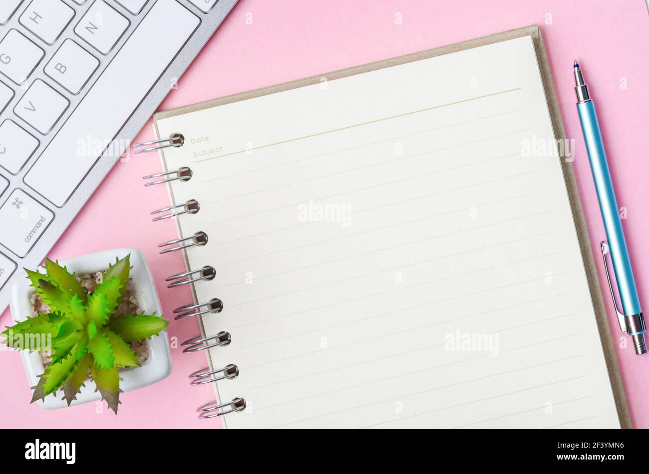 Open blank diary with keyboard computer on pink background Stock Photo ...