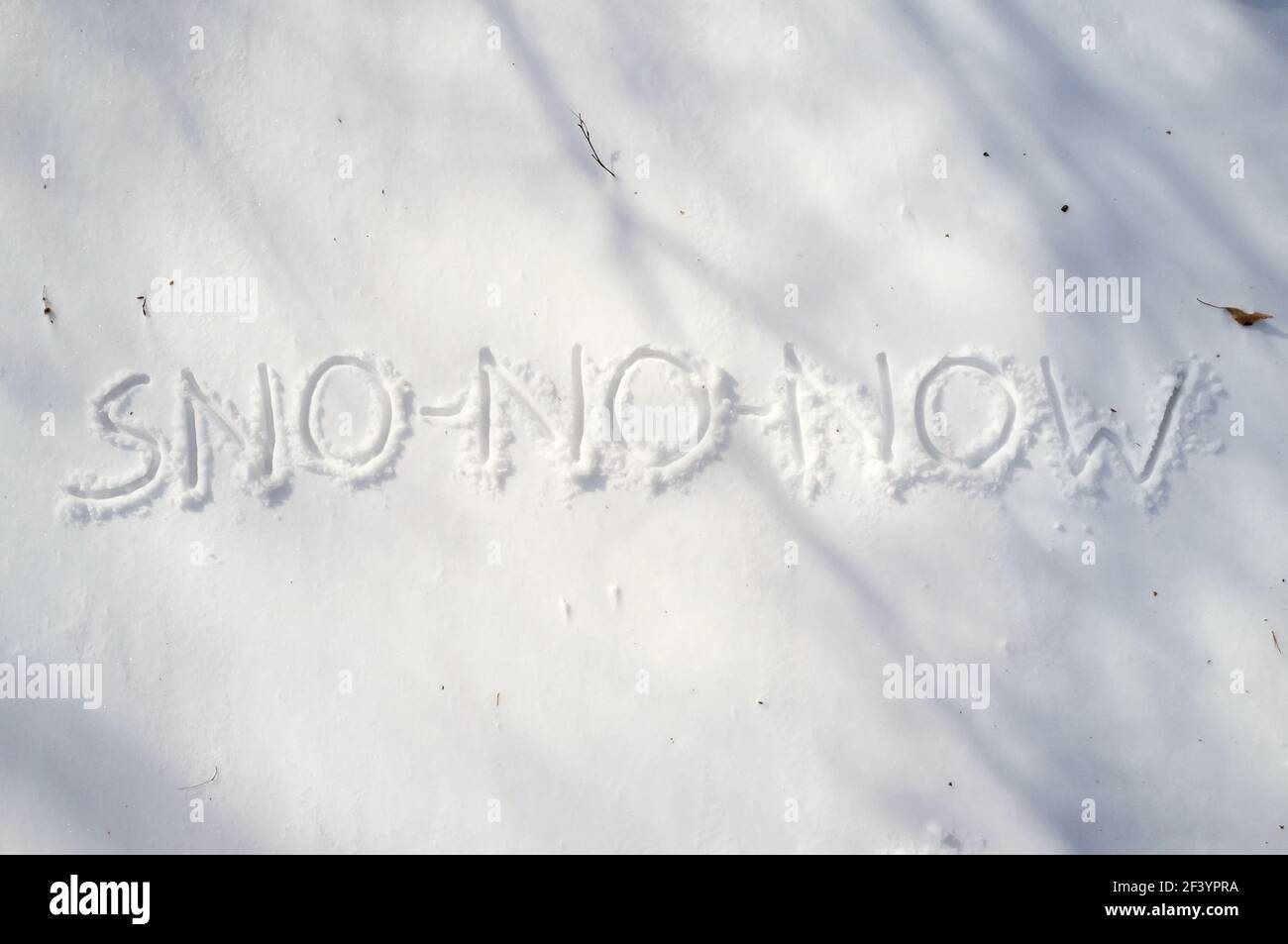 Word of snow and three large letters NO written on a snowbank. Spring ...