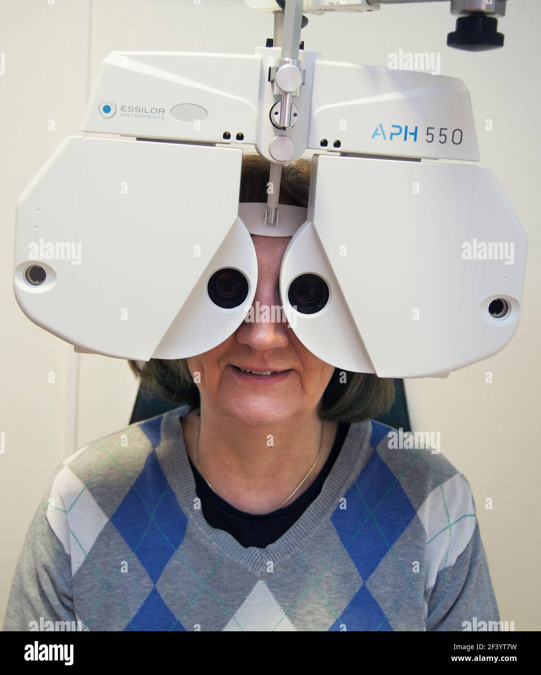 EYE EXAMINATION at a optician shop Stock Photo - Alamy