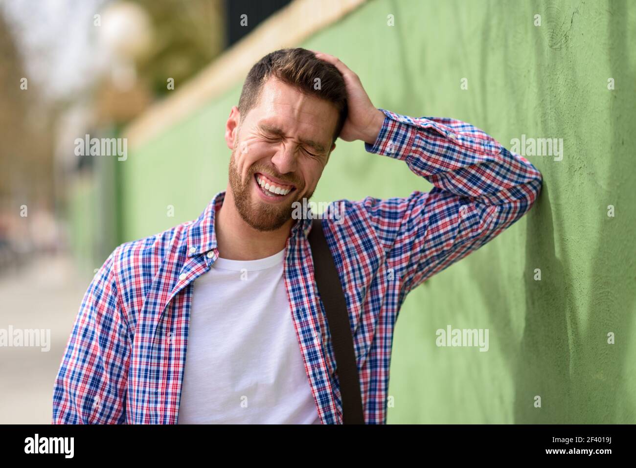 Attractive young man laughing outdoors. Lifestyle concept.. Attractive ...