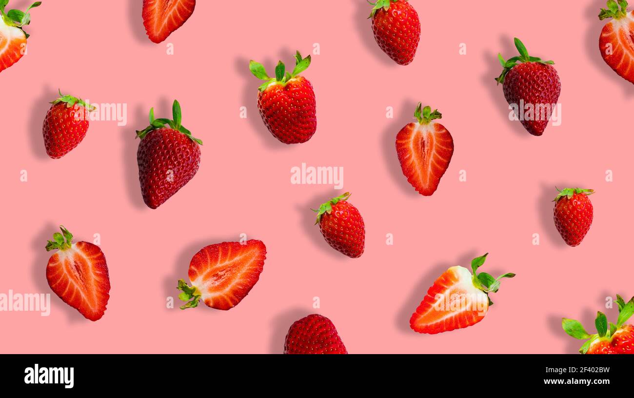 Different ripe strawberries and strawberry slices isolated on pink ...