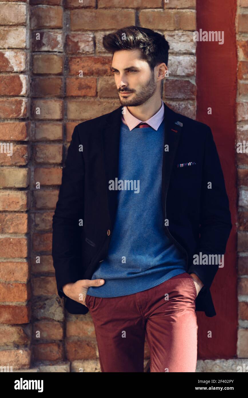 Attractive man in the street wearing british elegant suit. Young ...