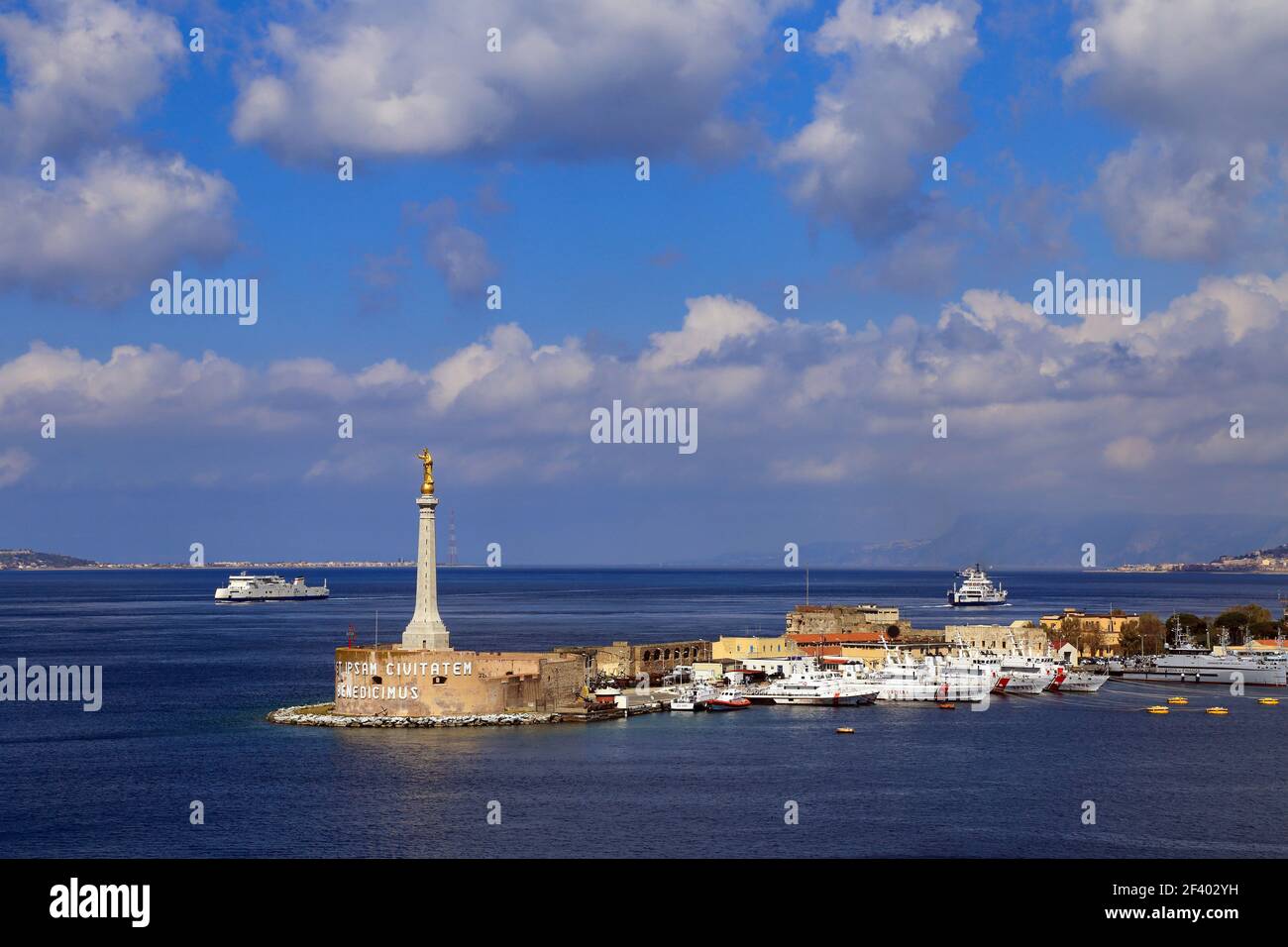 The entrance to Messina harbour, with the gold statue of Madonna della ...