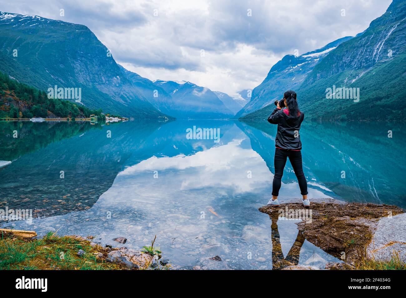 Nature photographer tourist with camera shoots lovatnet lake Bea ...