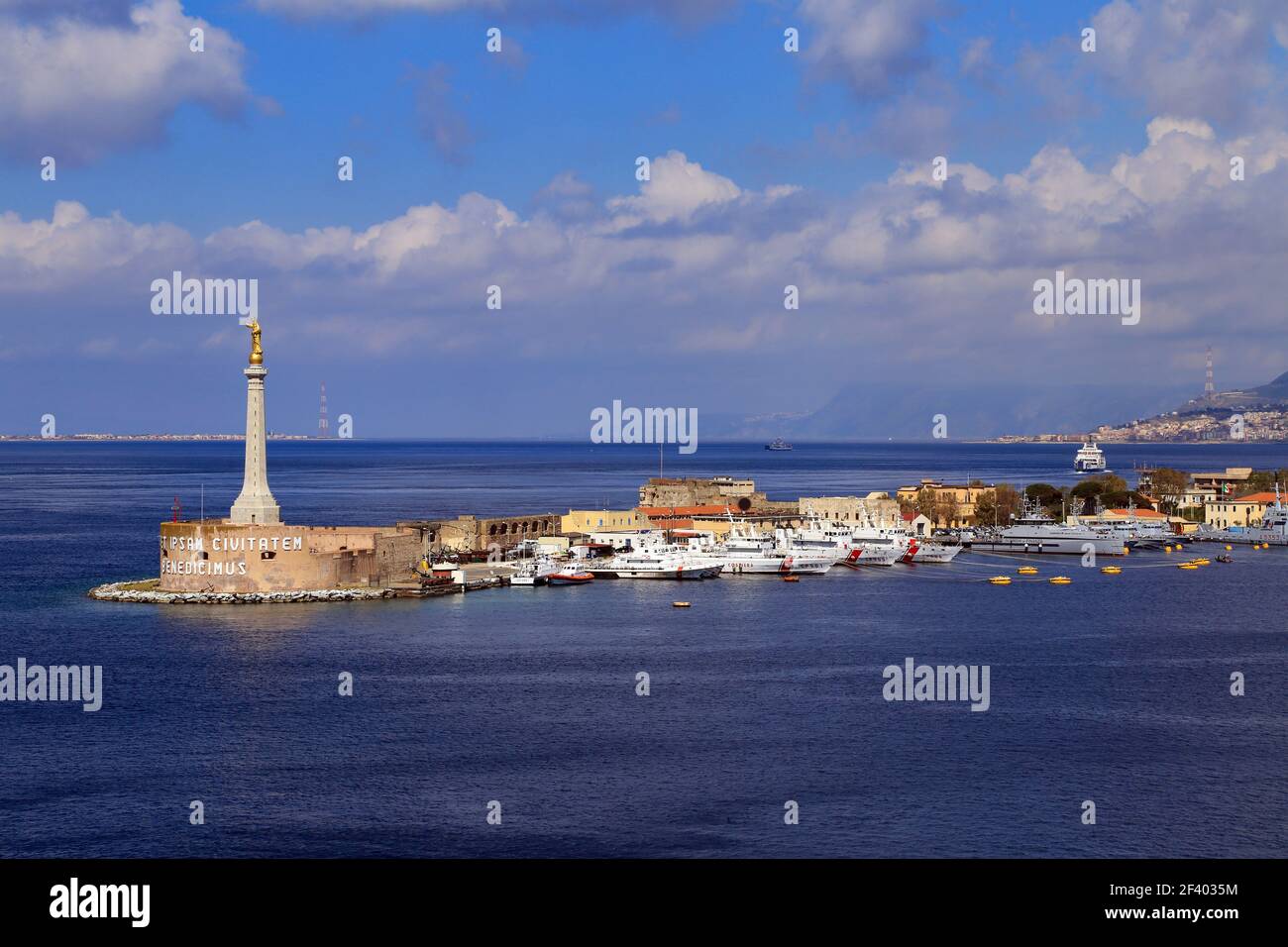 The entrance to Messina harbour, with the gold statue of Madonna della ...