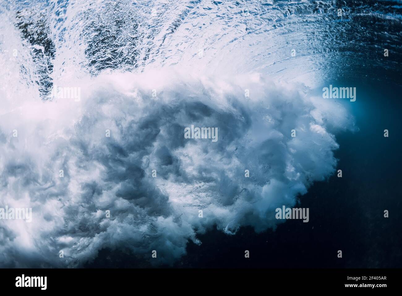 Wave underwater with foam, bubbles and sunlight. Transparent ocean in ...