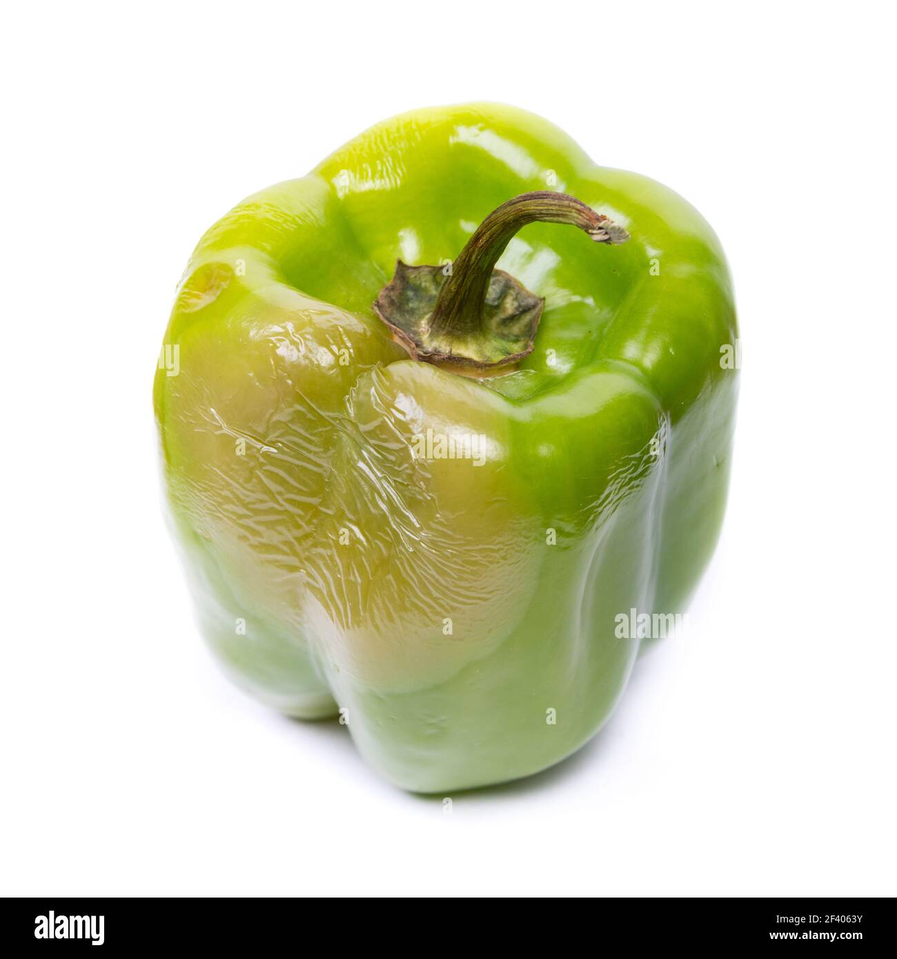 Rotten green bell pepper isolated on white background Stock Photo - Alamy