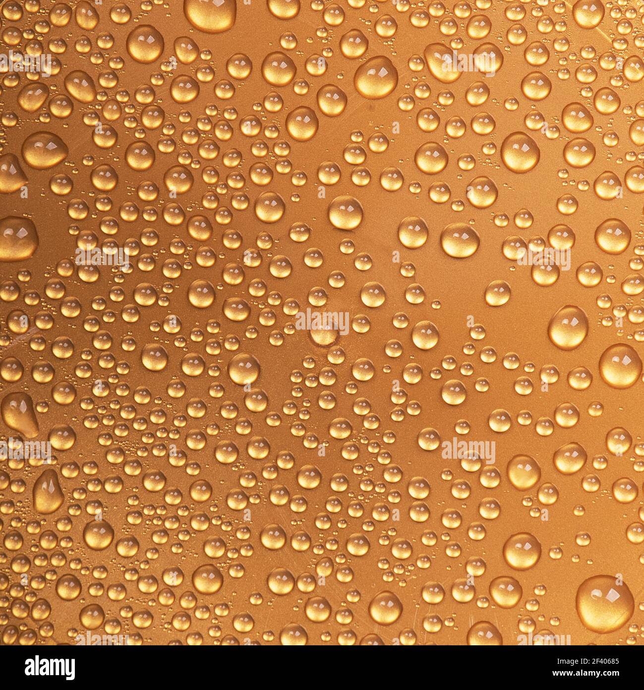 Texture of drops on golden background Stock Photo - Alamy