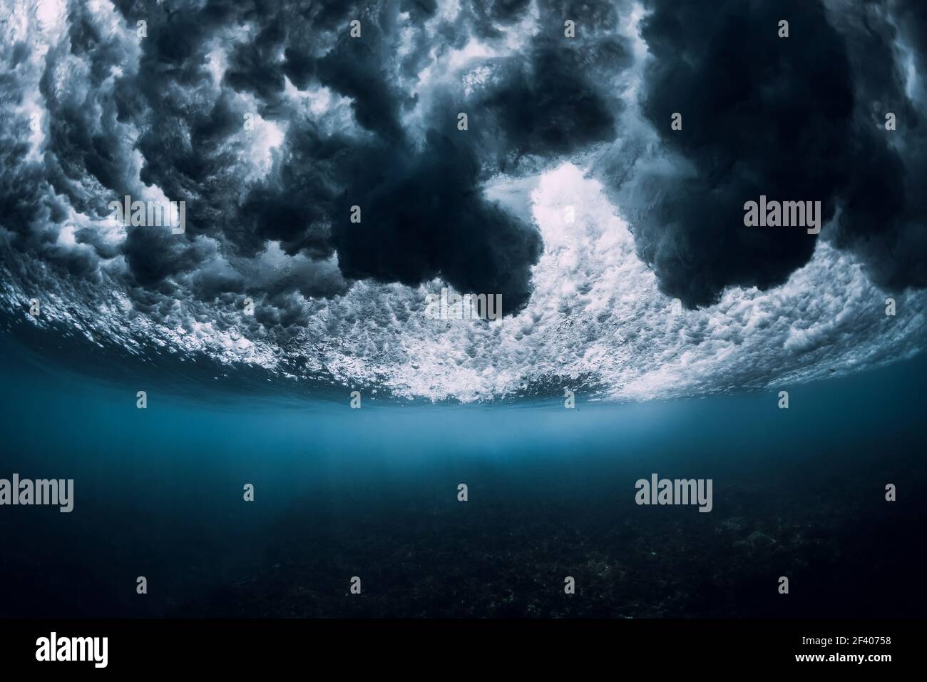 Wave underwater with foam, bubbles and sunlight. Transparent ocean in ...