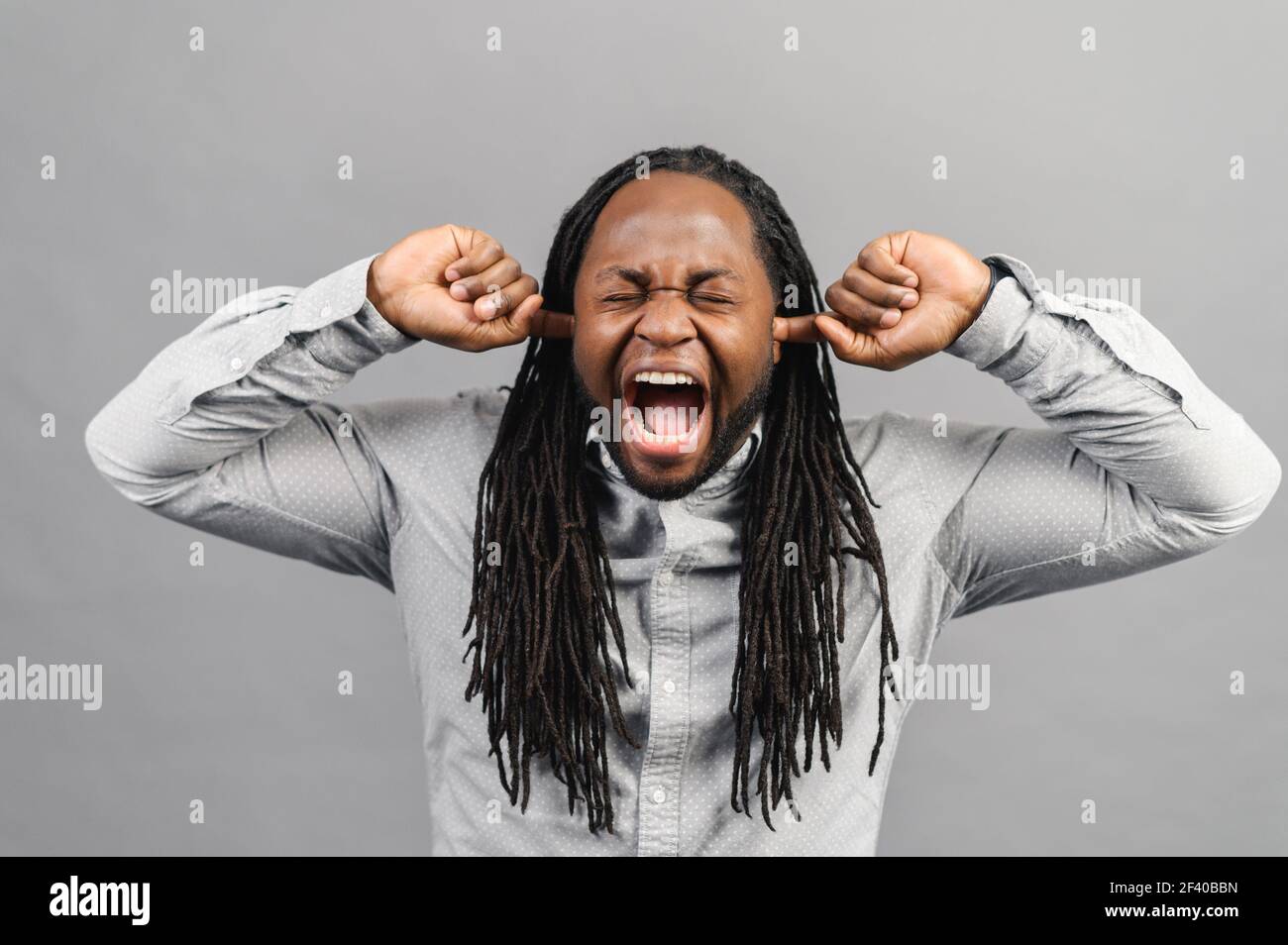 Plugging ears hi-res stock photography and images - Alamy