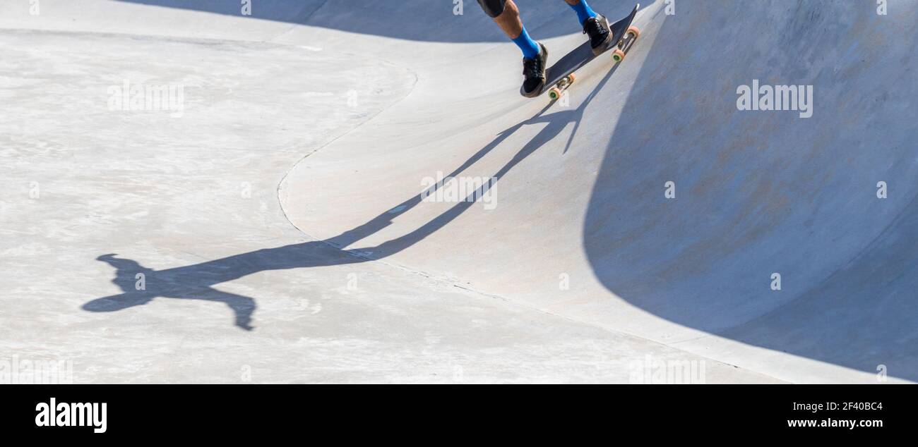 The shadow of a skateboarder on the ground at the skatepark Stock Photo ...