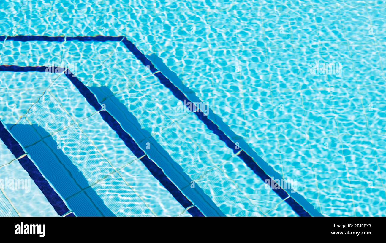 Overhead photography of ripples of water by steps in swimming pool ...