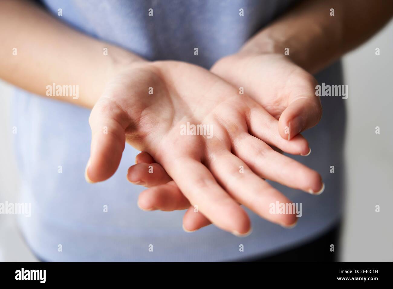 Close up rubbing hands woman hi-res stock photography and images - Alamy