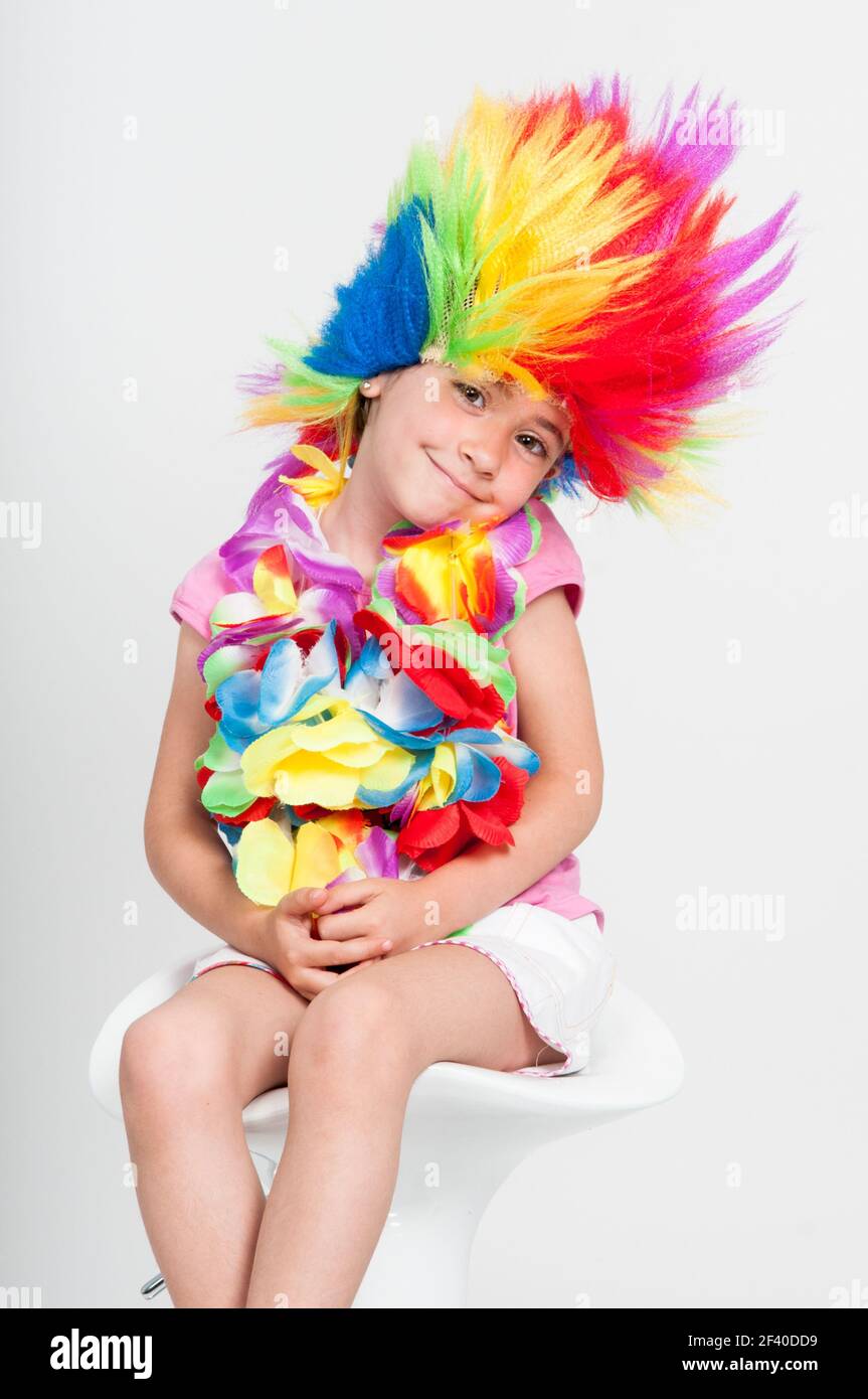 Funny beautiful party little girl in disguise with wig in many colors ...