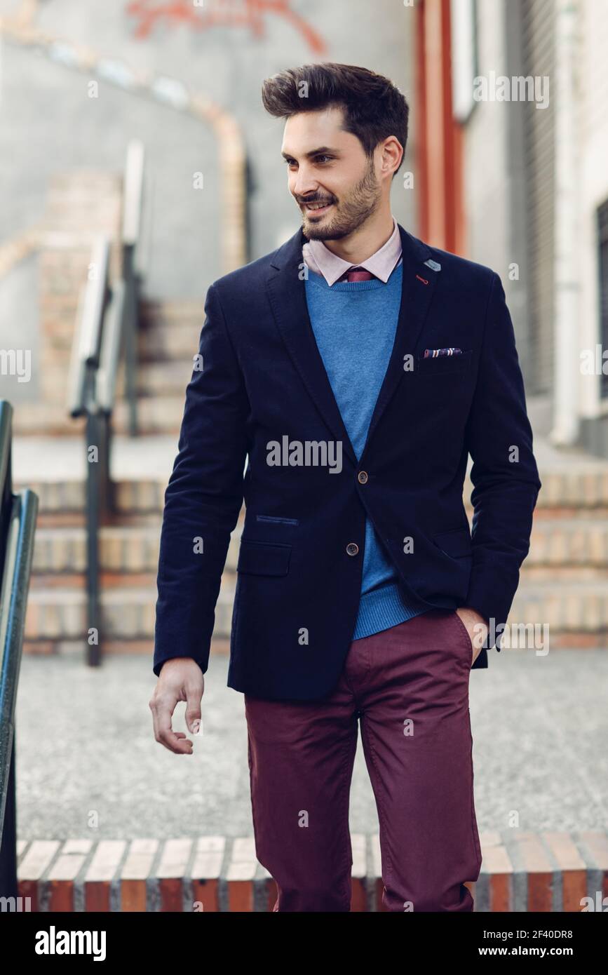 Attractive man in the street wearing british elegant suit. Young ...