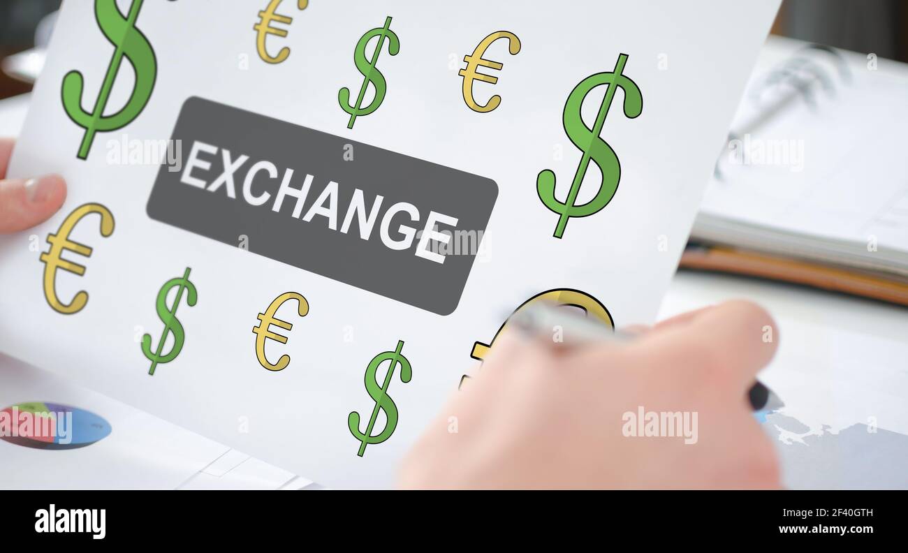 Hands holding a paper showing an exchange concept Stock Photo - Alamy