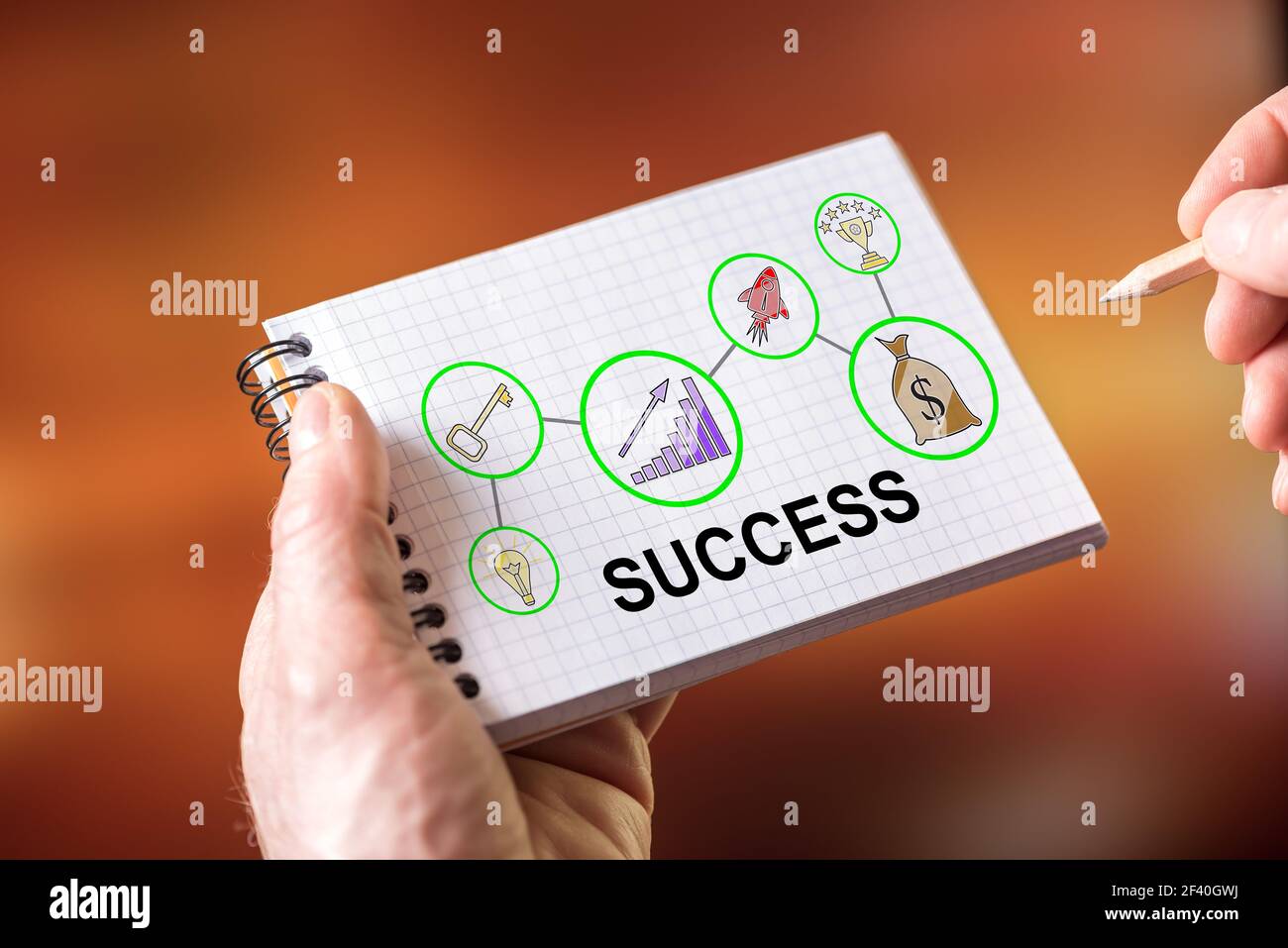 Hand drawing success concept on a notepad Stock Photo - Alamy