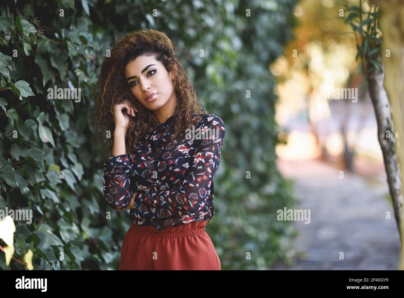 Beautiful young arabic woman with black curly hairstyle. Arab girl ...
