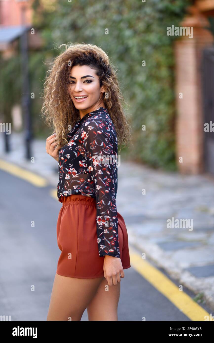 Happy young arabic woman with black curly hairstyle. Arab girl smiling ...