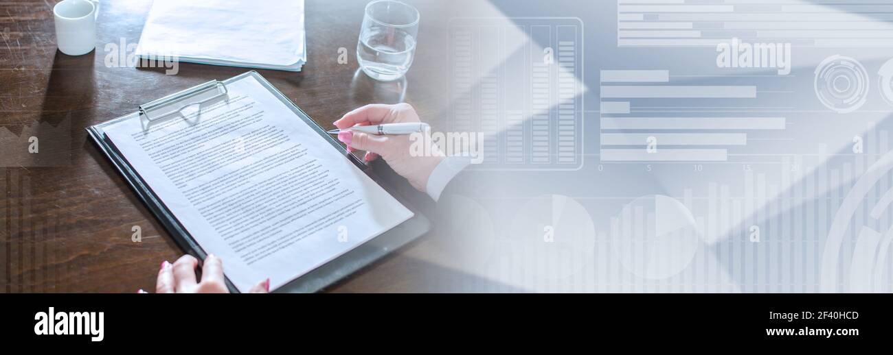 Reading documents at office; panoramic banner Stock Photo - Alamy