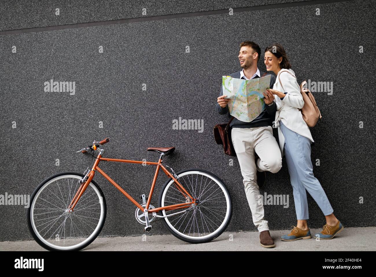 Holidays, dating and tourism concept. Smiling couple in love with map ...