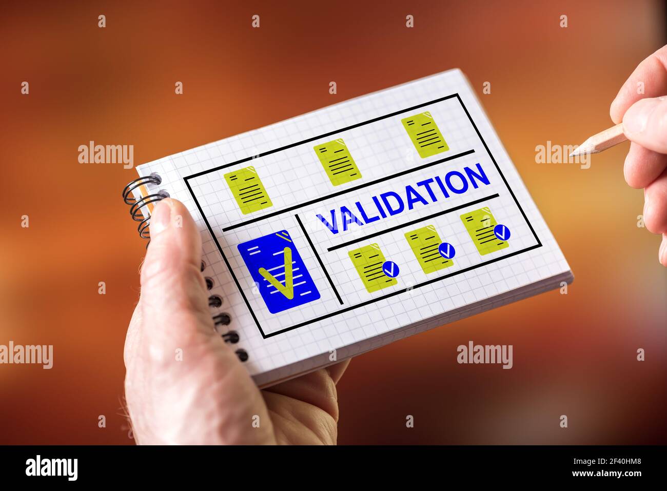 Hand drawing validation concept on a notepad Stock Photo - Alamy