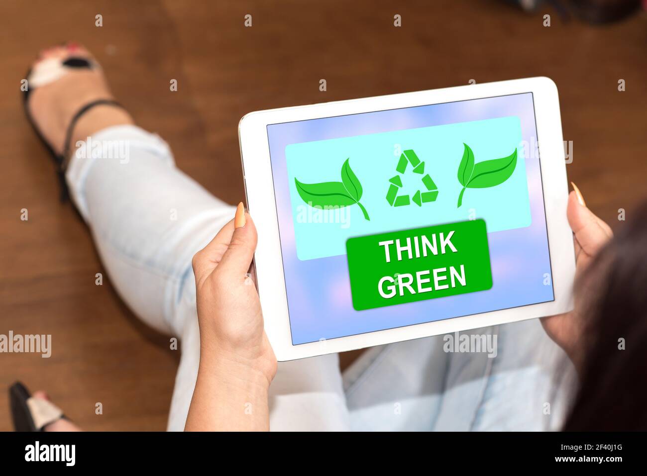 Tablet screen displaying a think green concept Stock Photo - Alamy
