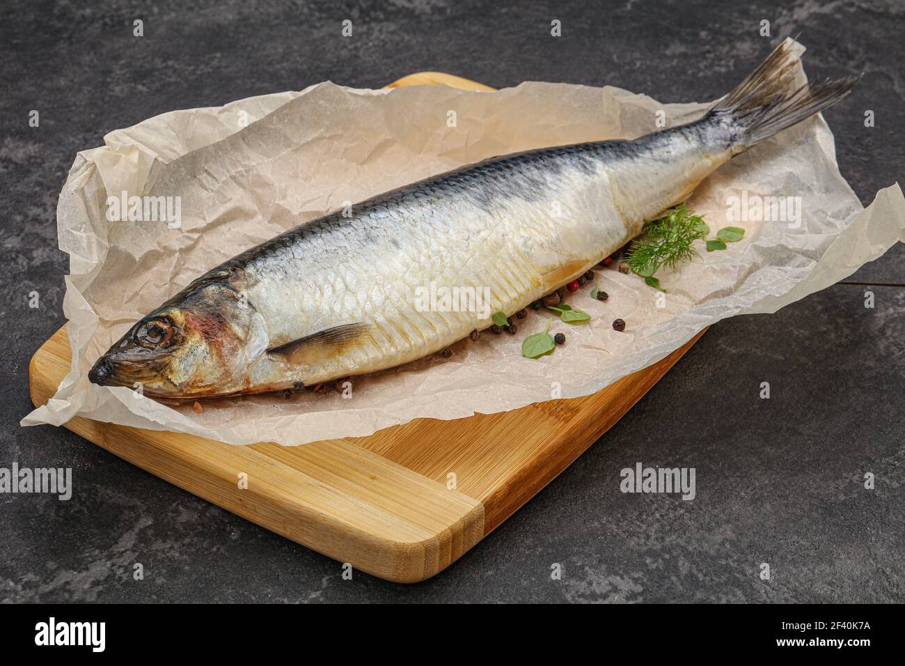 Salted Herring fish with pepper and spices Stock Photo - Alamy