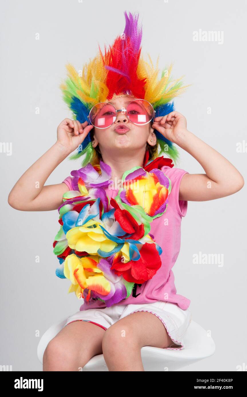 Funny beautiful party little girl in disguise with wig in many colors ...