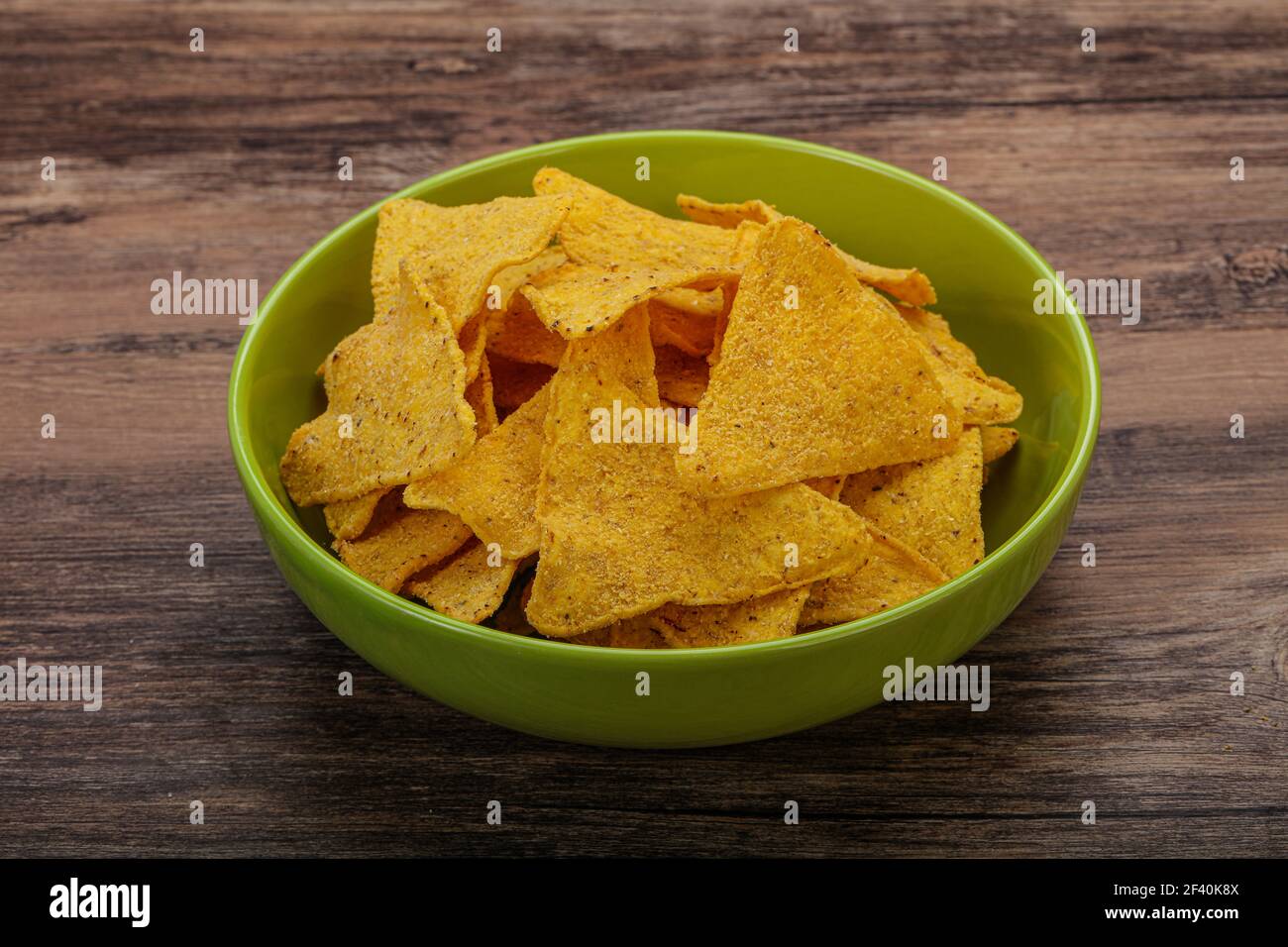 Mexican crunchy corn nachos triangle heap Stock Photo - Alamy