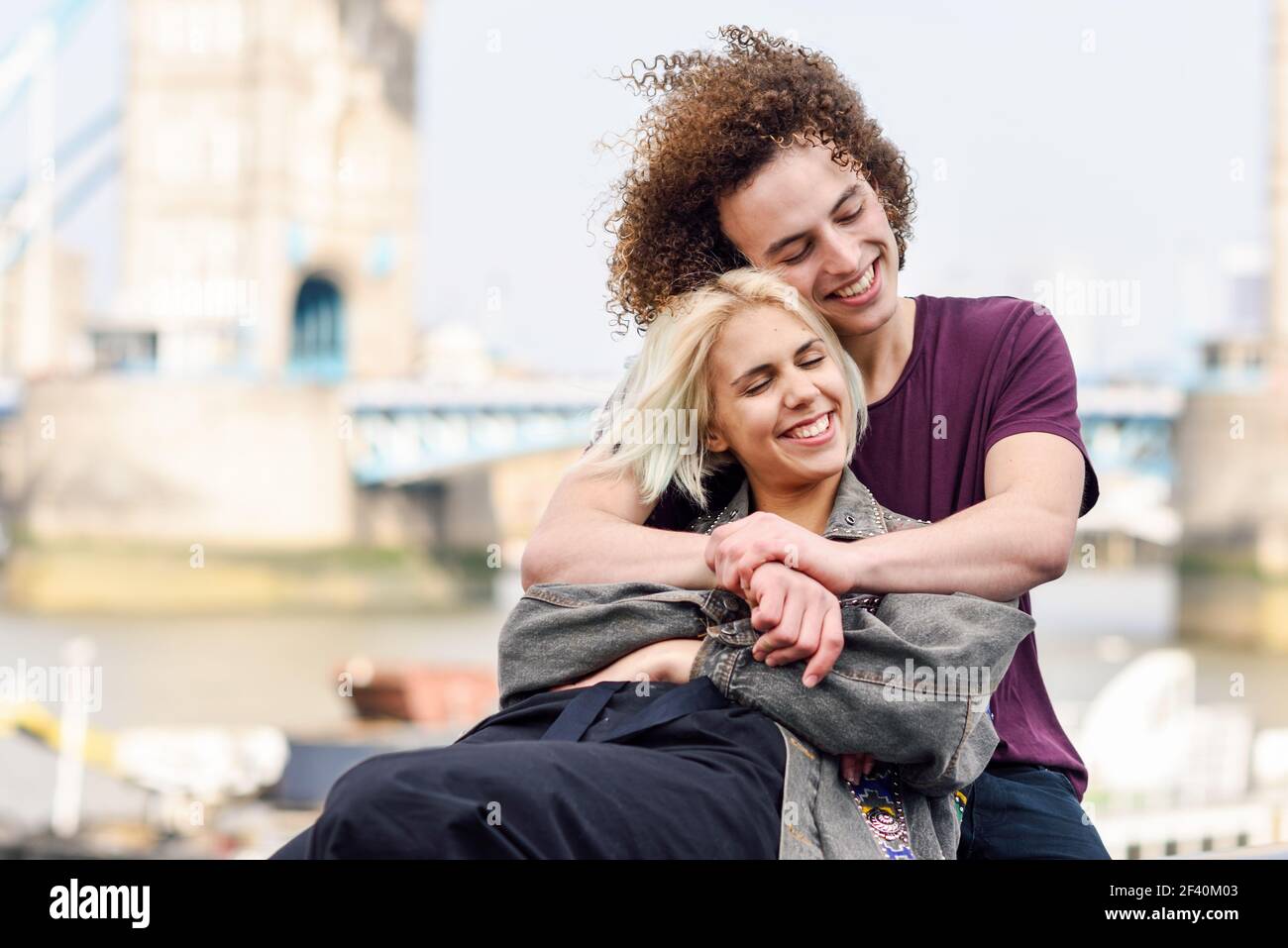 Happy couple hugging at the Tower Bridge, River Thames, London. UK ...
