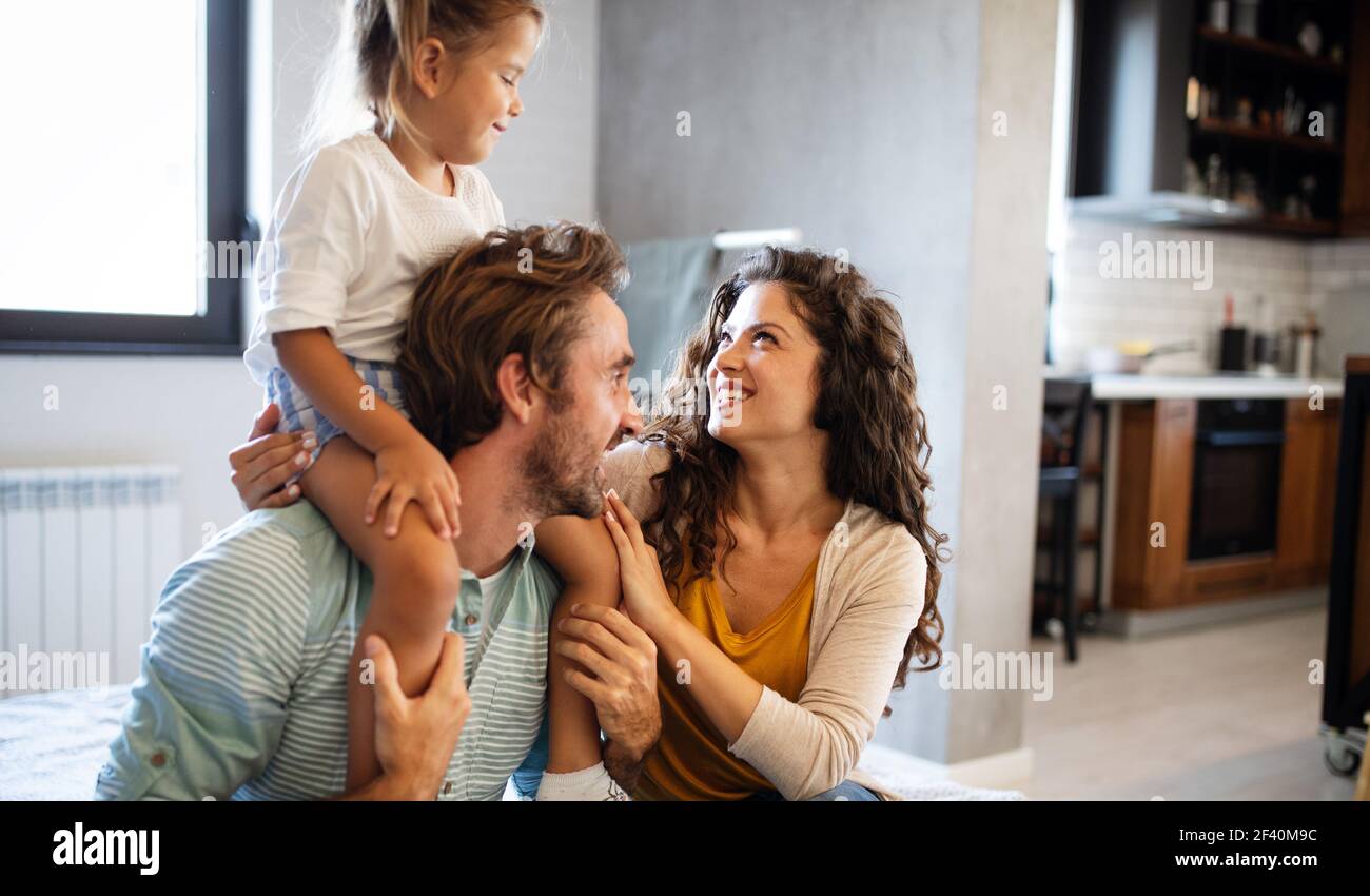 Happy family having fun times at home Stock Photo - Alamy