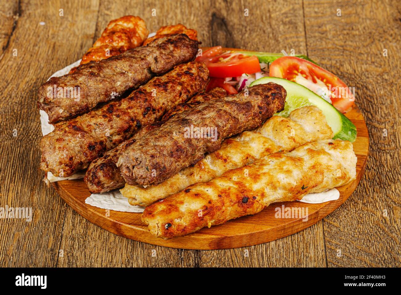 Tasty hot minced meat kebab set Stock Photo - Alamy