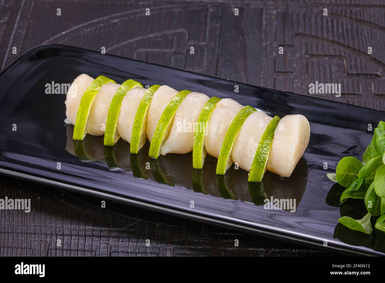 Japanese cuisine Sashimi with raw scallop Stock Photo - Alamy