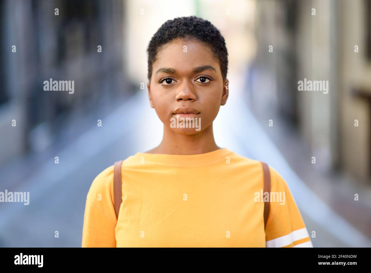 Young African Woman Wearing Casual Clothes Looking At Camera Girl With