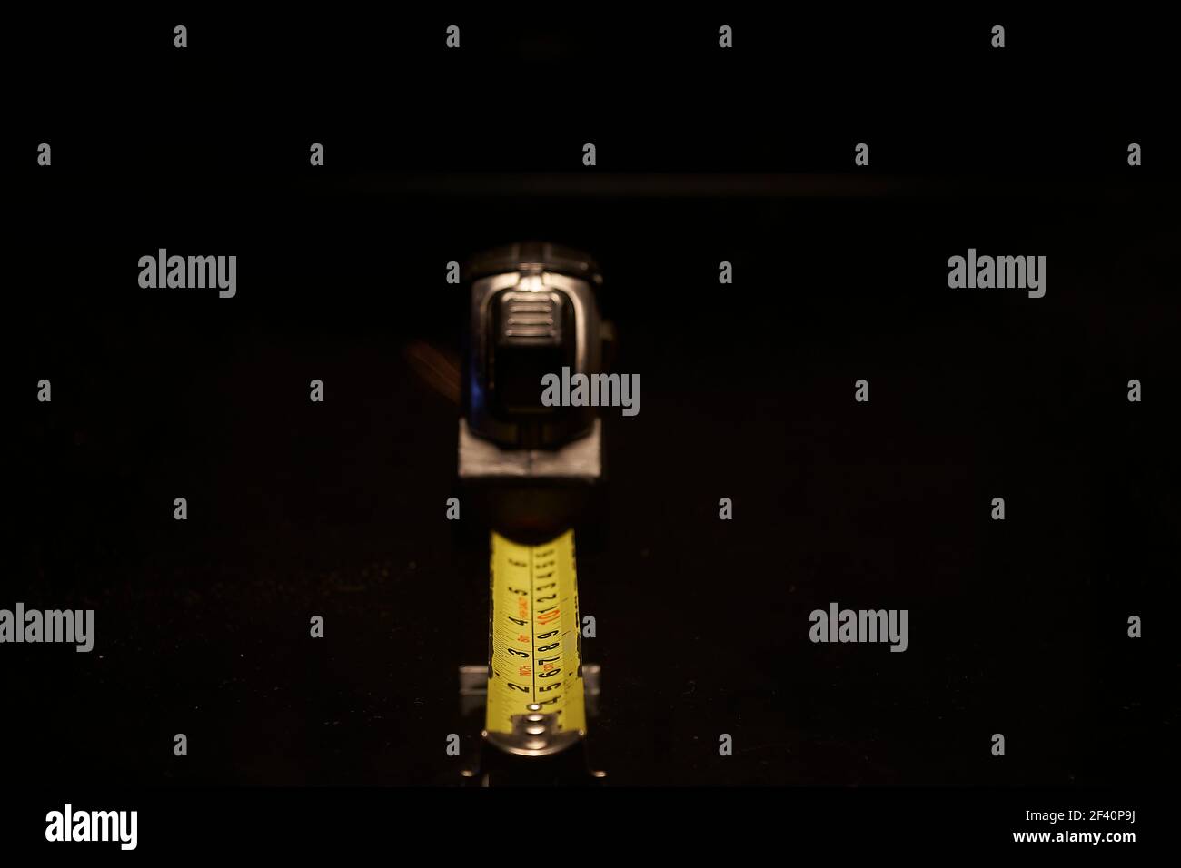 Yellow meter against black background Stock Photo - Alamy