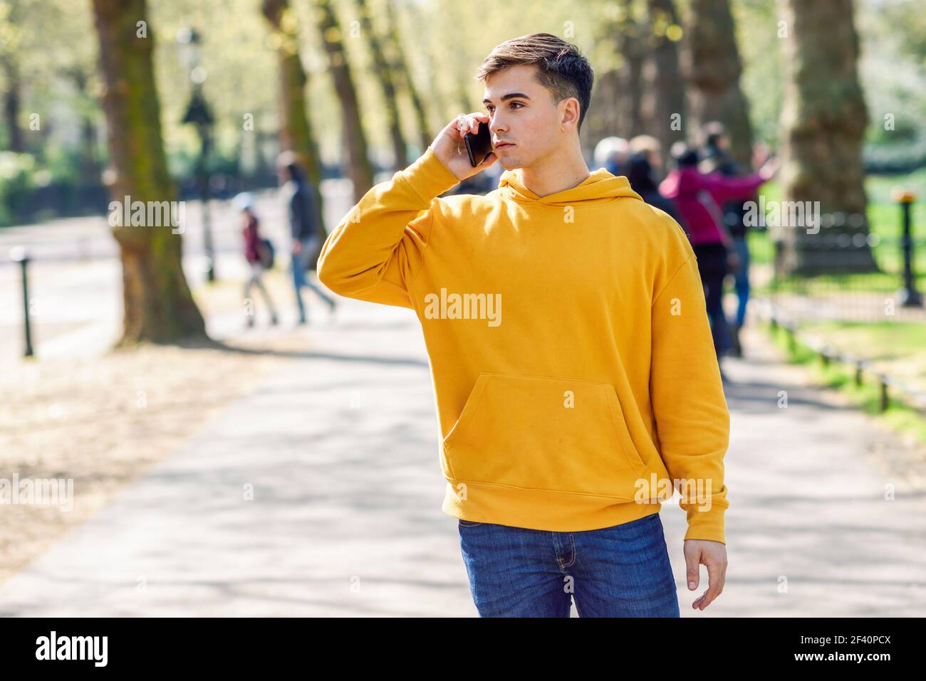 Cool young man walking city hi-res stock photography and images - Alamy