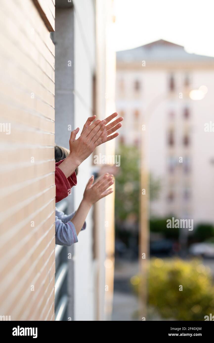 People in Spain clapping in the window in support of people who fight ...