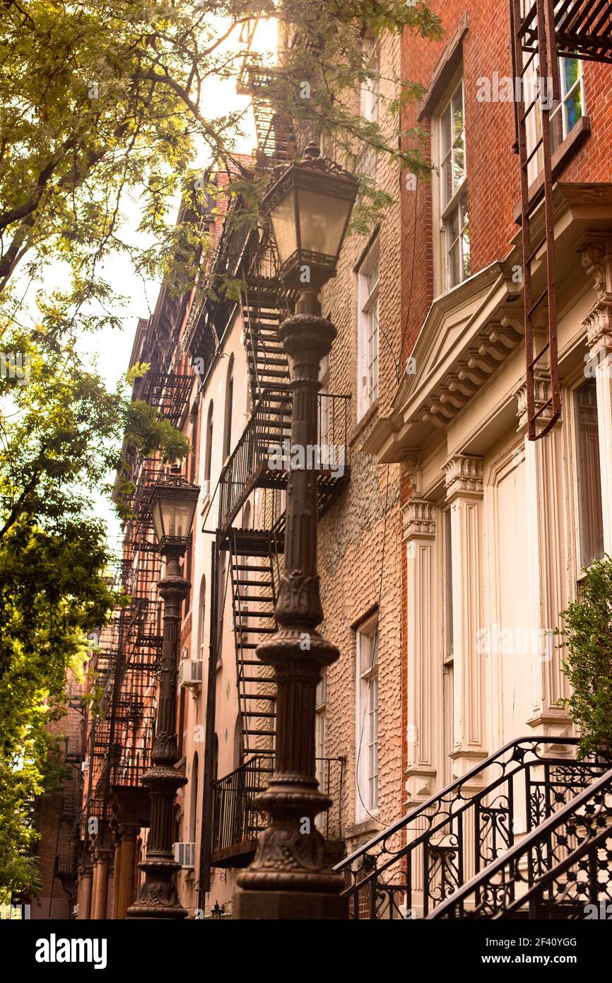 Street scene of residential neighborhood with a row of buildings seen ...