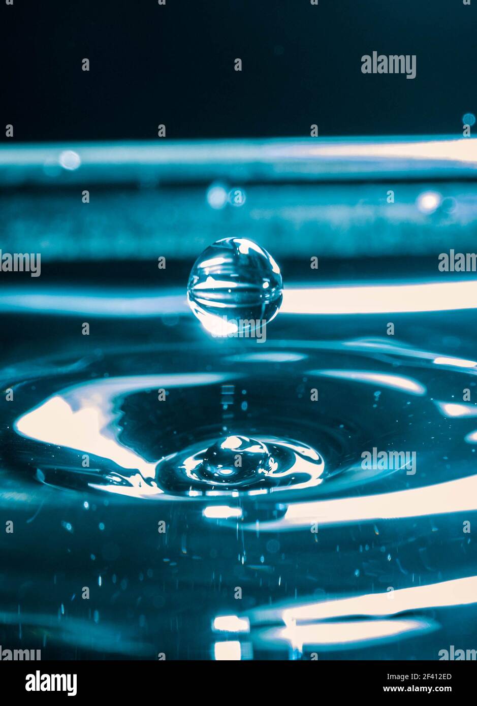 Colored water drop, circle ripples, splash of water, closeup Stock ...